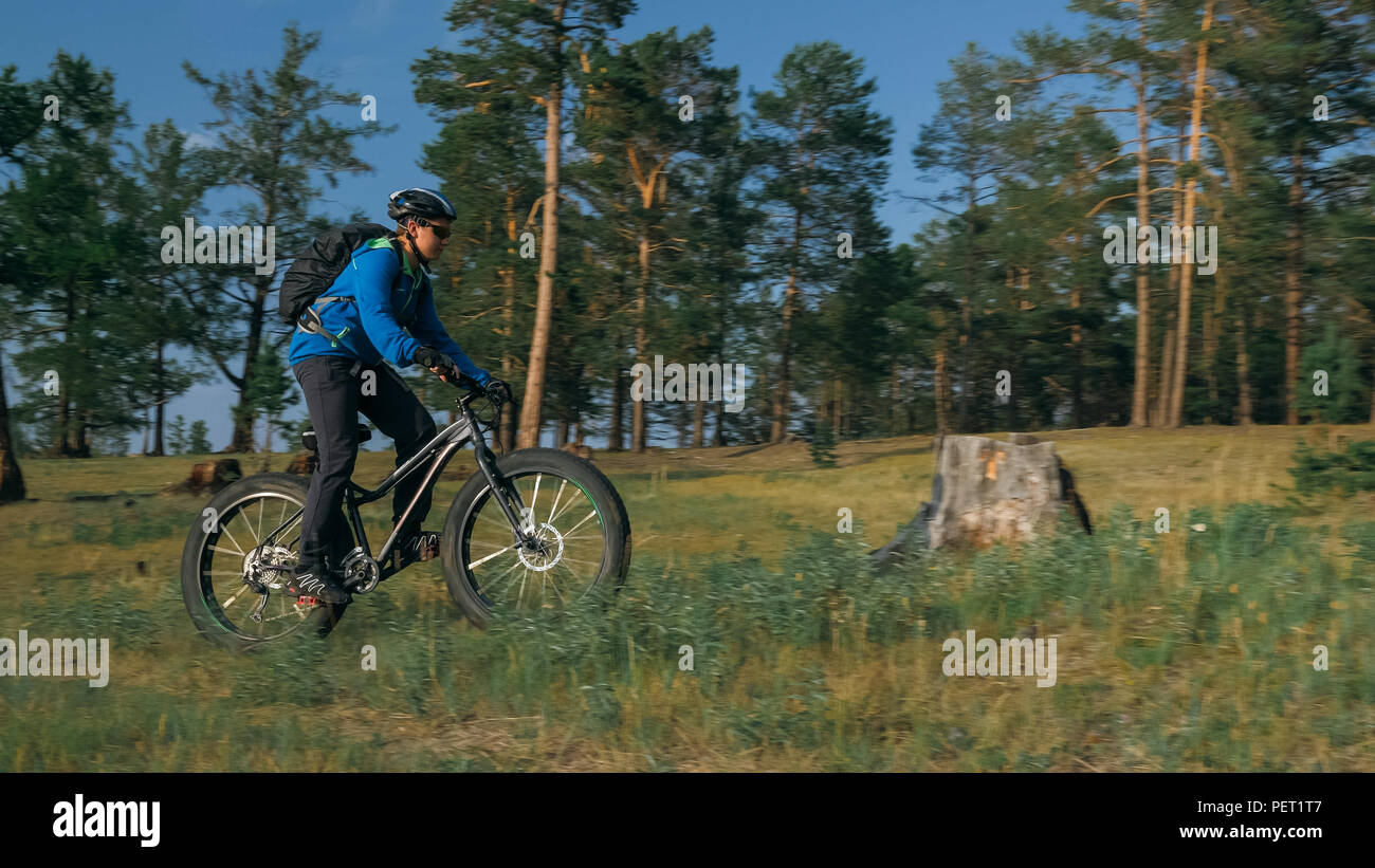 Fat bike also called fatbike or fat-tire bike in summer riding in the ...