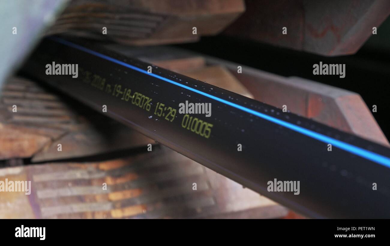 Pipes manufacturing production line. Manufacture of plastic water pipes ...