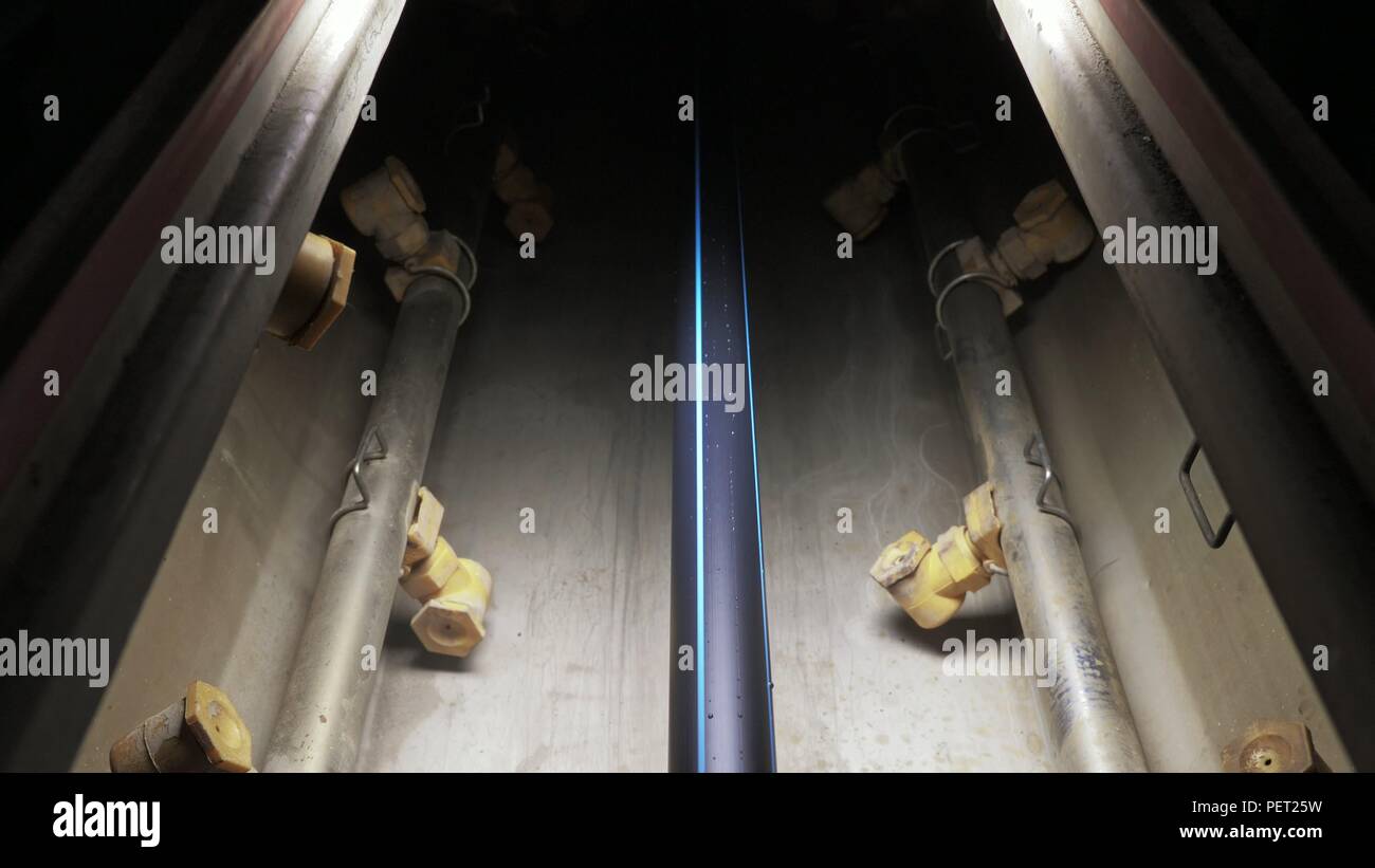 Pipes manufacturing production line. Manufacture of plastic water pipes ...