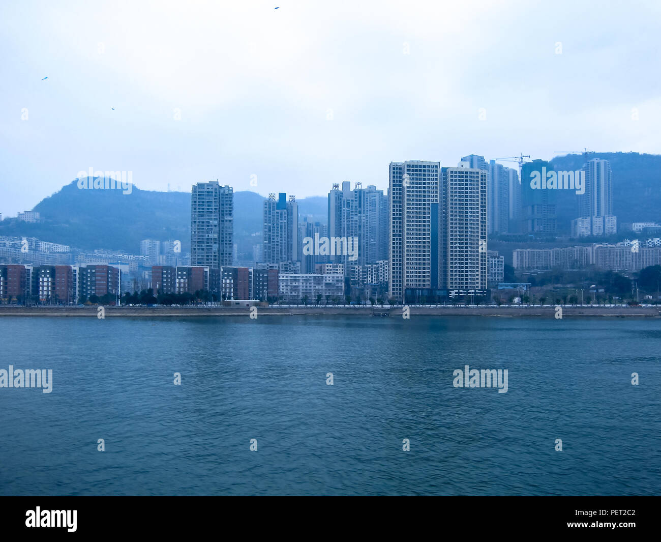 Chinese Modern Buildings on Waterside Stock Photo - Alamy
