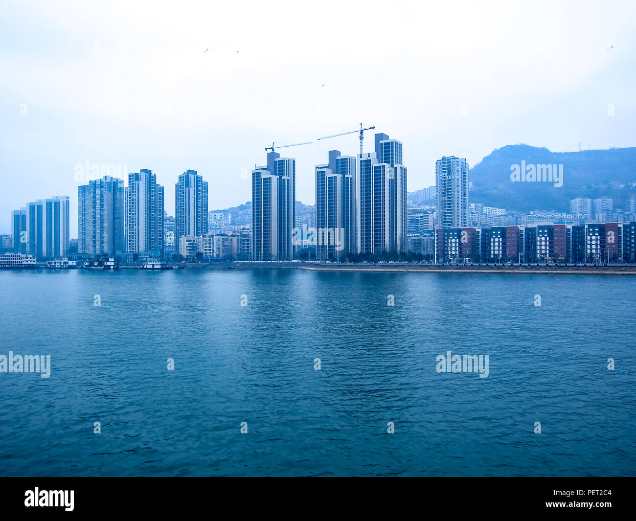 Chinese Modern Buildings on Waterside Stock Photo - Alamy