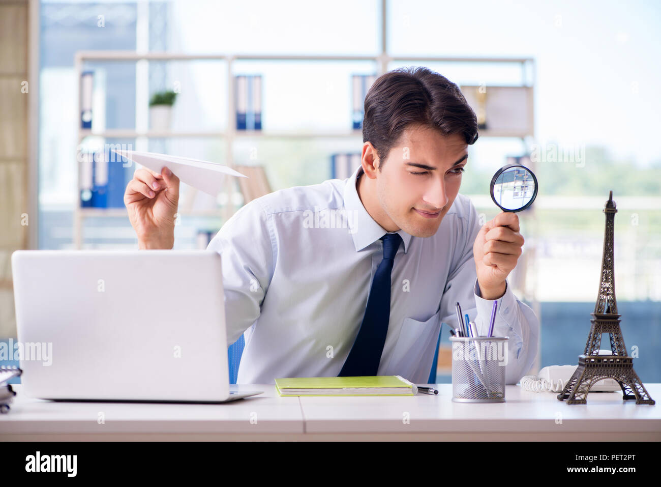Sales agent working in travel agency Stock Photo - Alamy