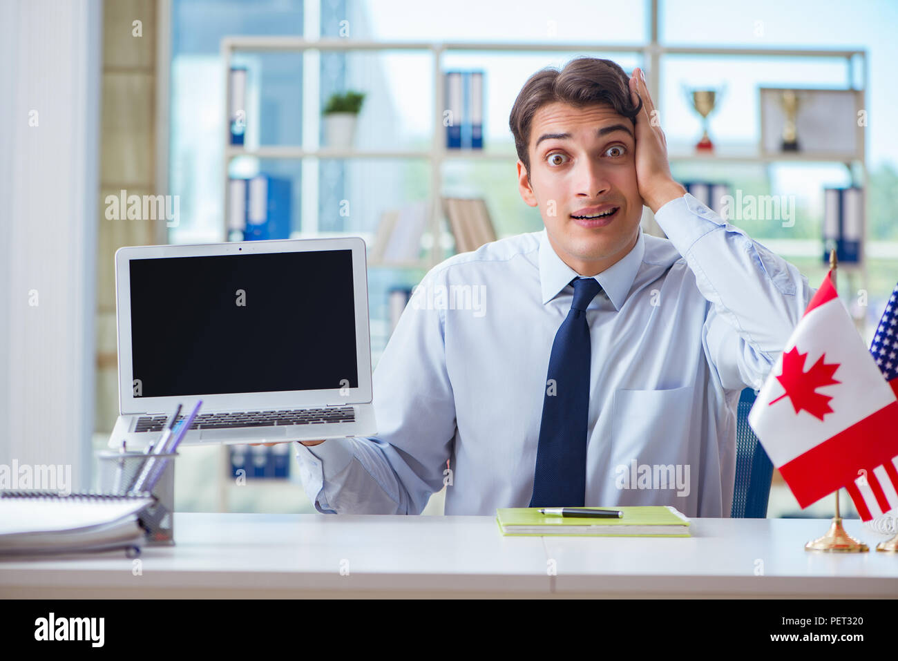 Sales agent working in travel agency Stock Photo - Alamy