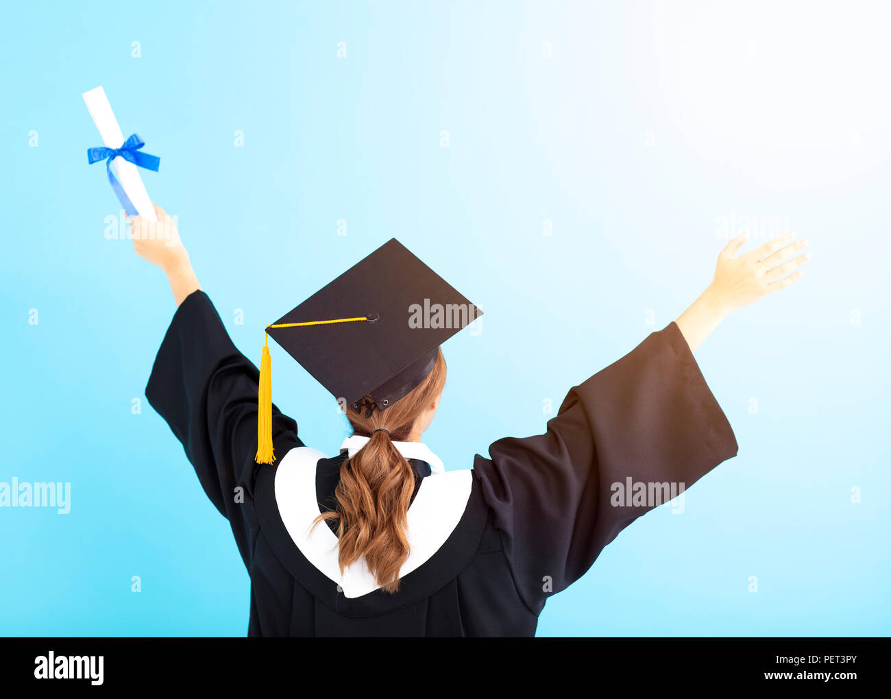 rear view graduate student holding diploma isolated Stock Photo - Alamy