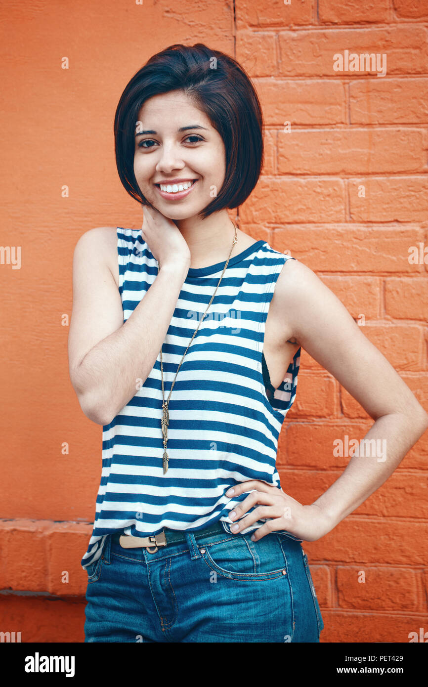 Portrait of beautiful smiling young hipster latin hispanic girl woman ...