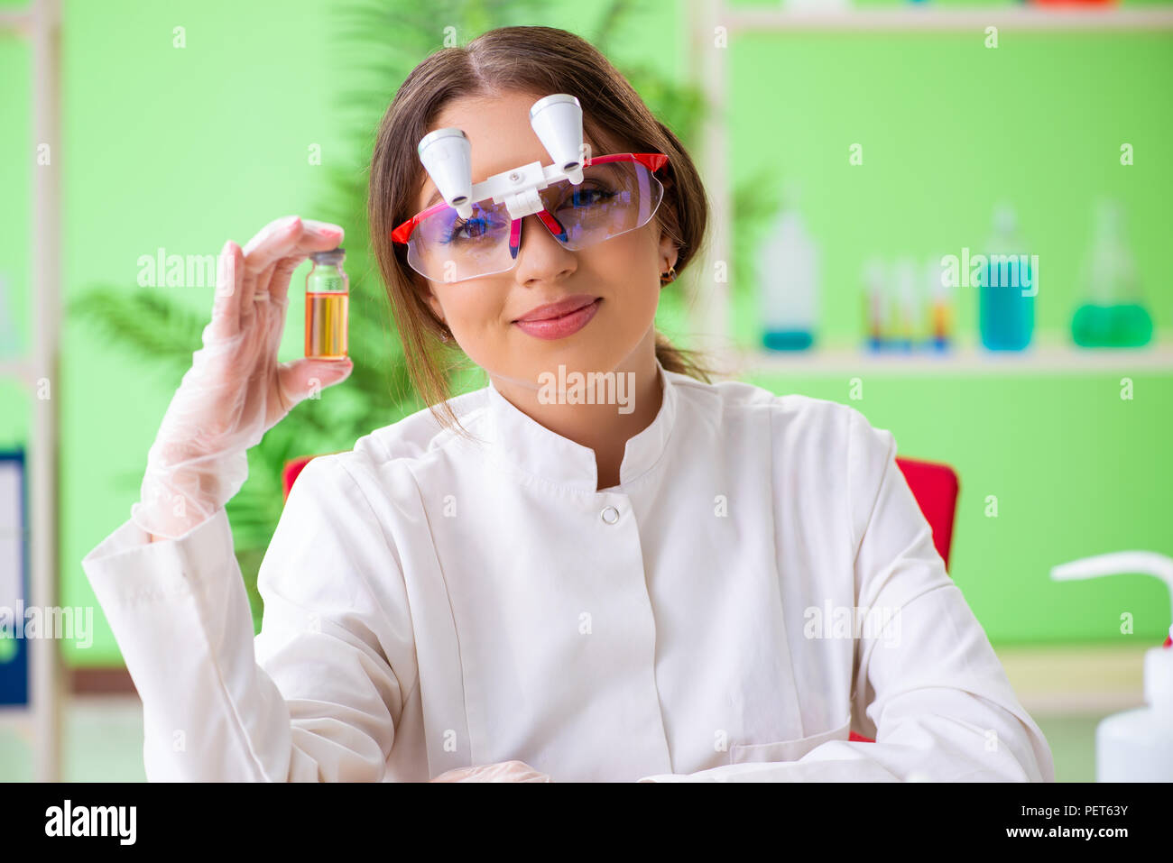 Beautiful female biotechnology scientist chemist working in lab Stock ...