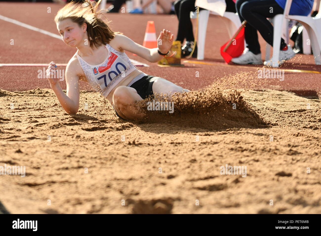 Young girl performs a long jump attempt in local competitions Stock ...