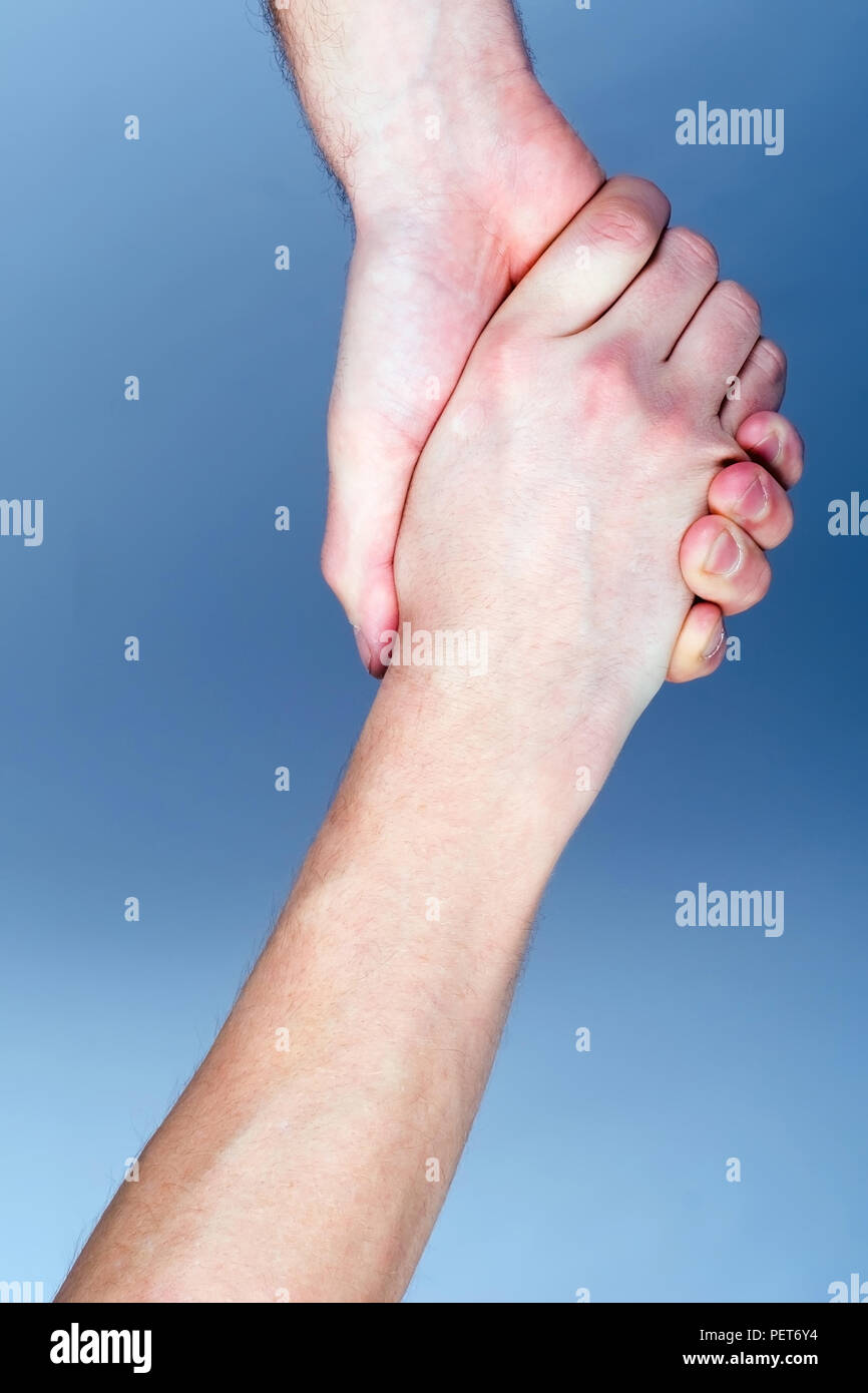 helping hand isolated on a blue background Stock Photo - Alamy