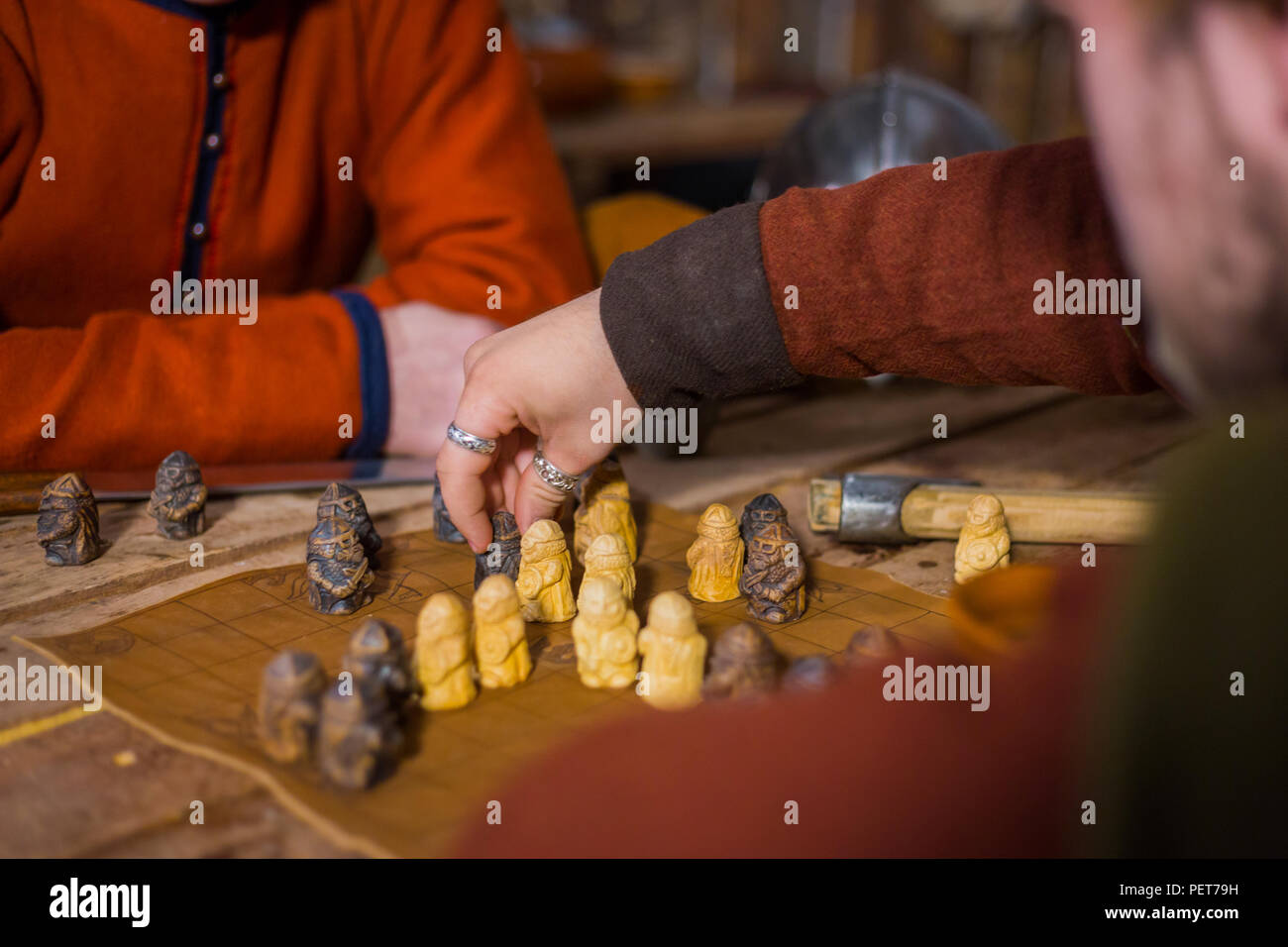 Two men in russian ethnic suit playing medieval popular strategy board ...