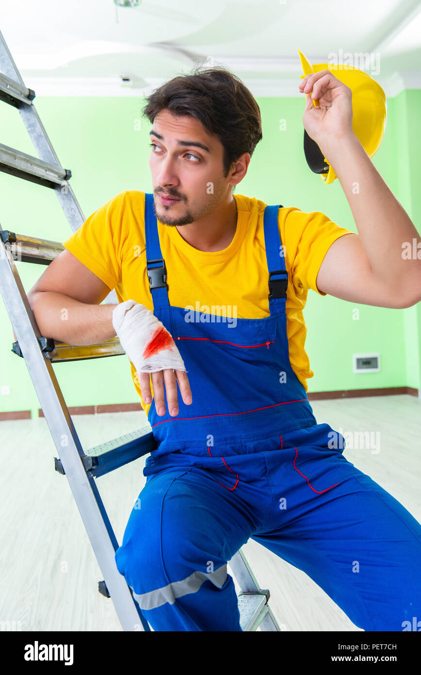 Injured worker at the work site Stock Photo - Alamy
