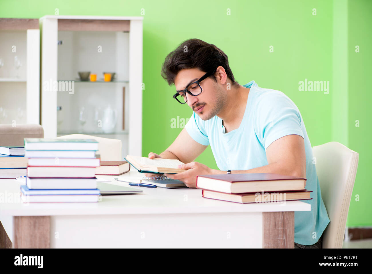 Student preparing for university exams at home Stock Photo - Alamy