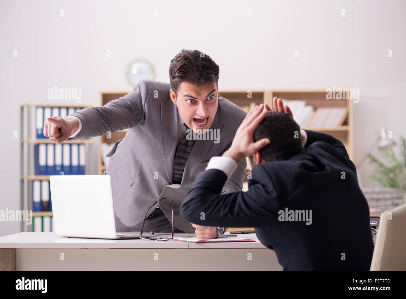 Angry boss shouting at his employee Stock Photo - Alamy