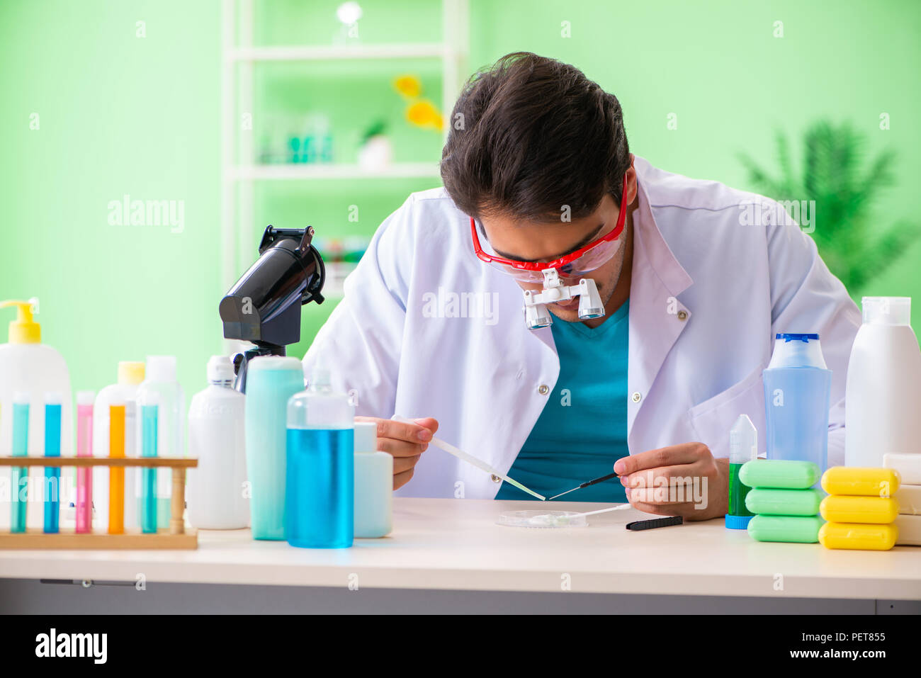 Chemist testing soap in the lab Stock Photo - Alamy