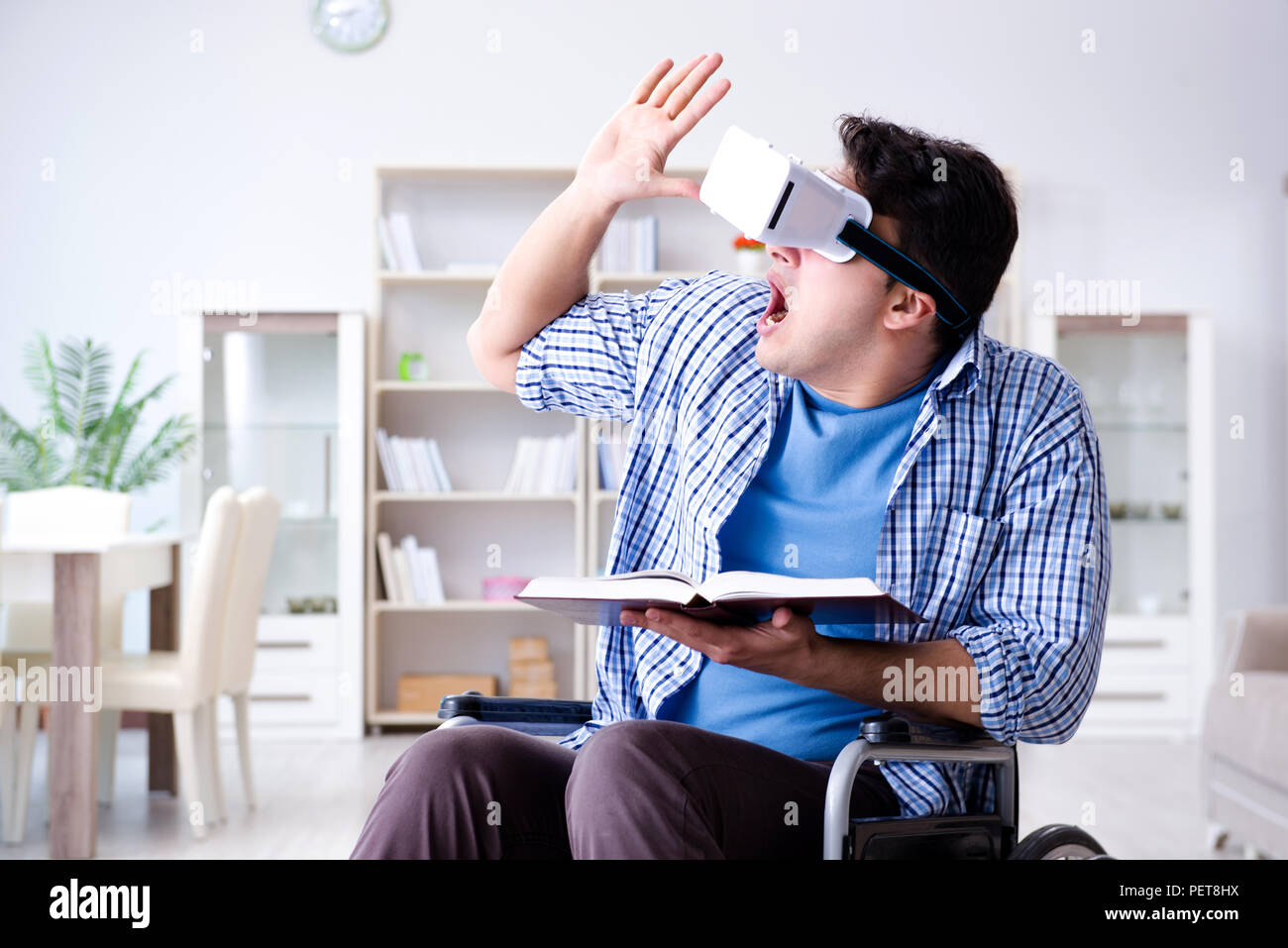 Disabled student studying with virtual reality glasses Stock Photo - Alamy