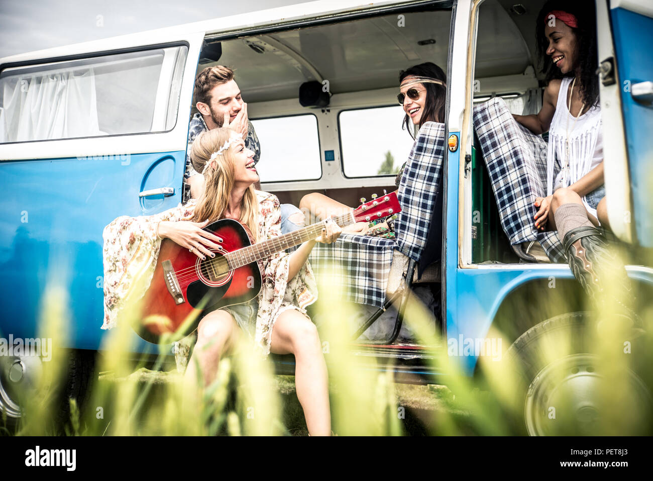 Hippie friends having fun Stock Photo - Alamy