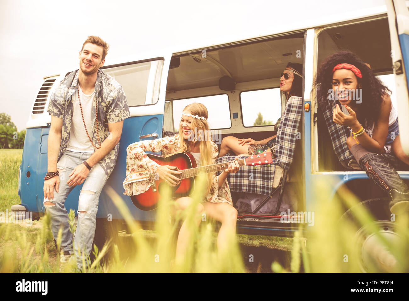 Hippie friends having fun Stock Photo - Alamy