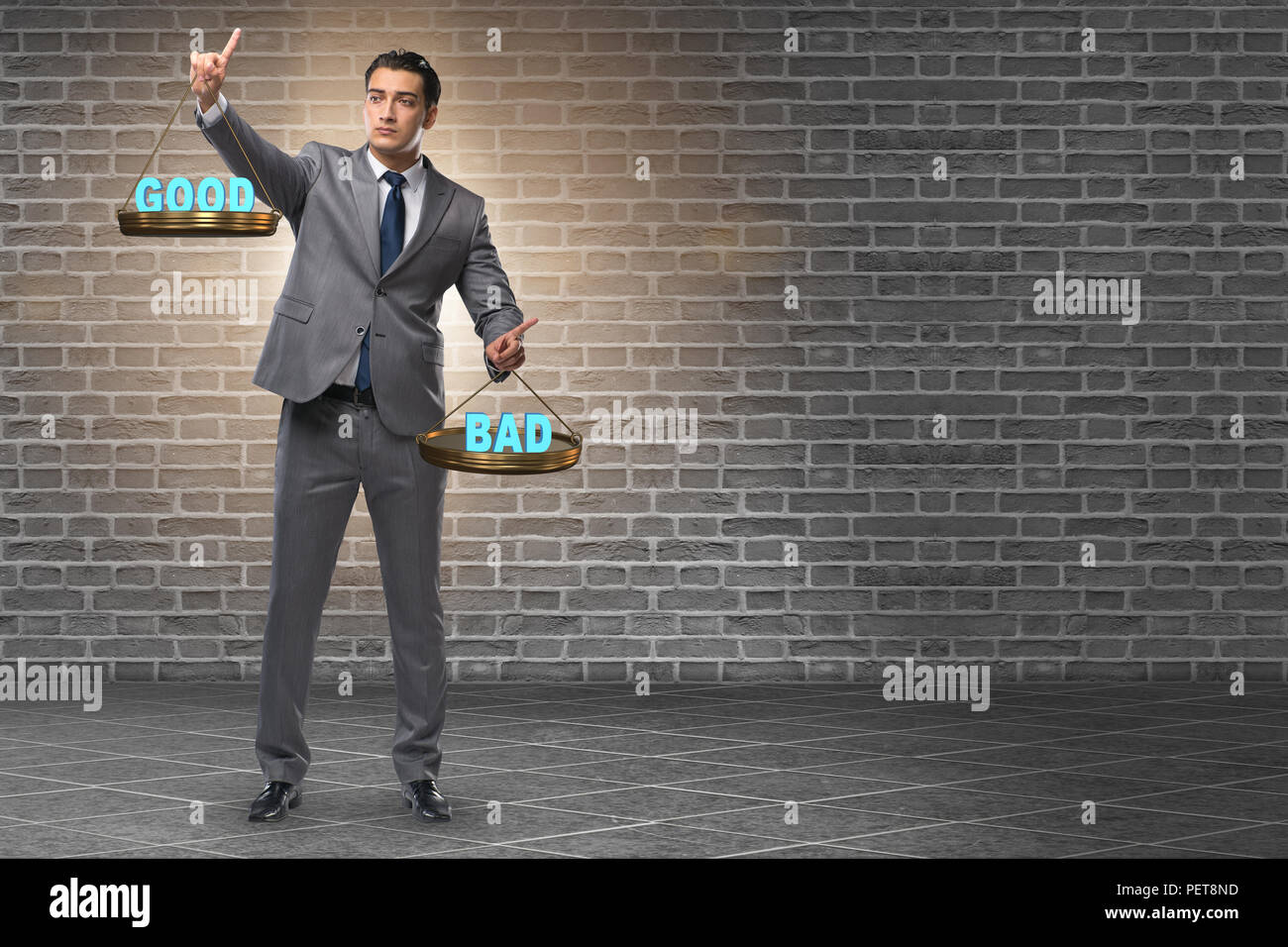 Businessman choosing between good and bad Stock Photo - Alamy