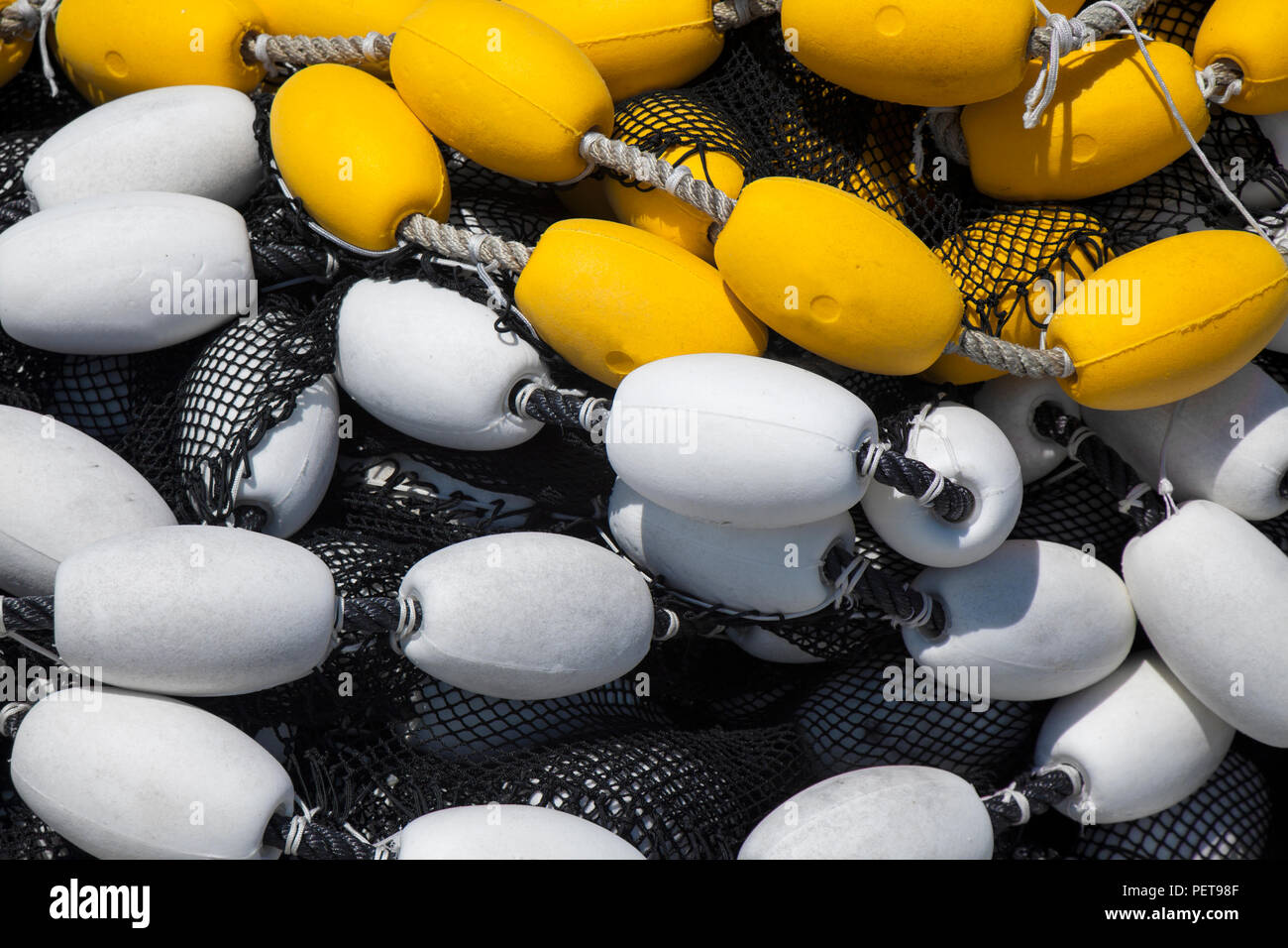 large black fishing net with floats in white and yellow abstract Stock ...