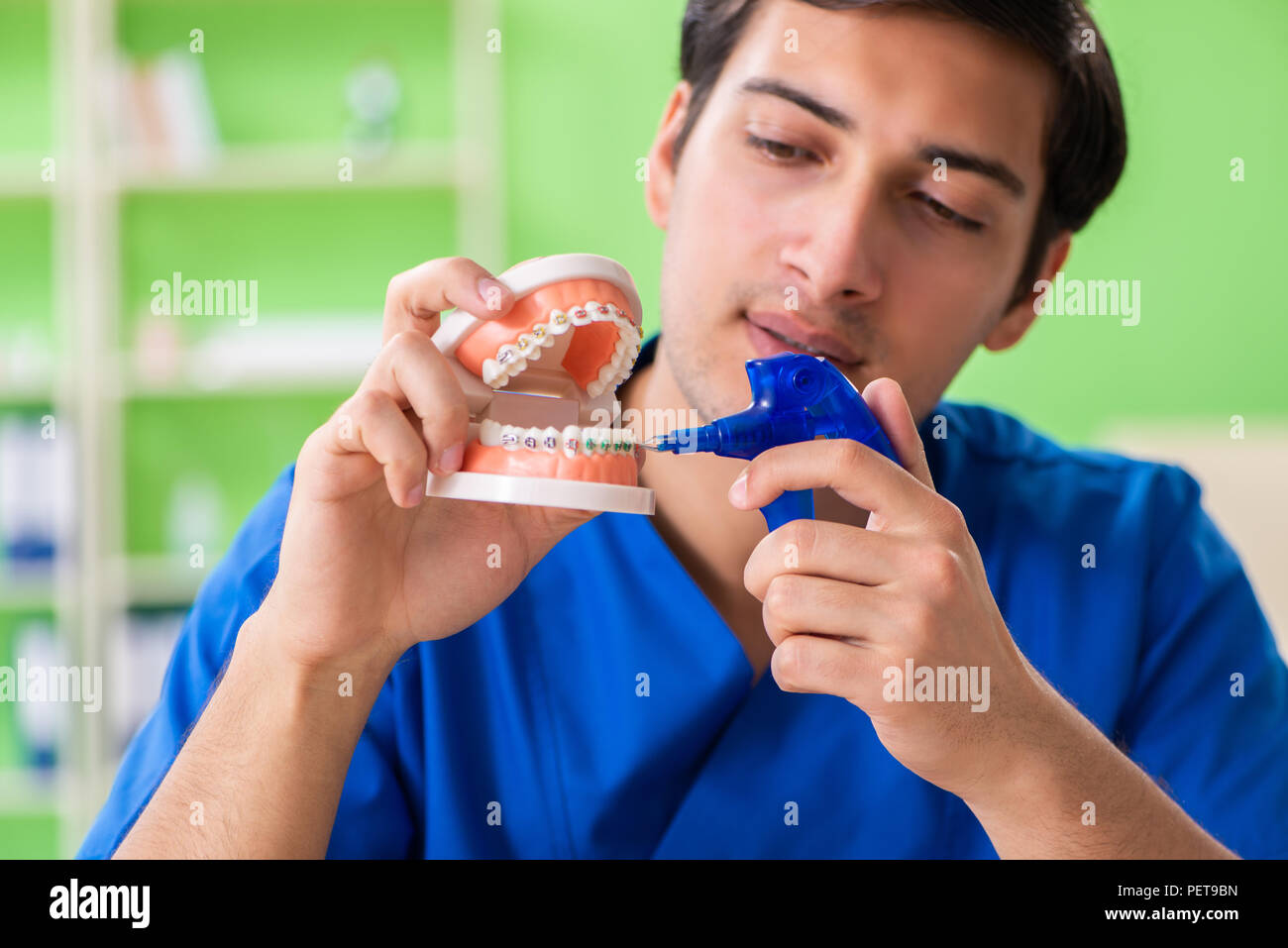 Dentist doctor working on new tooth implant Stock Photo - Alamy