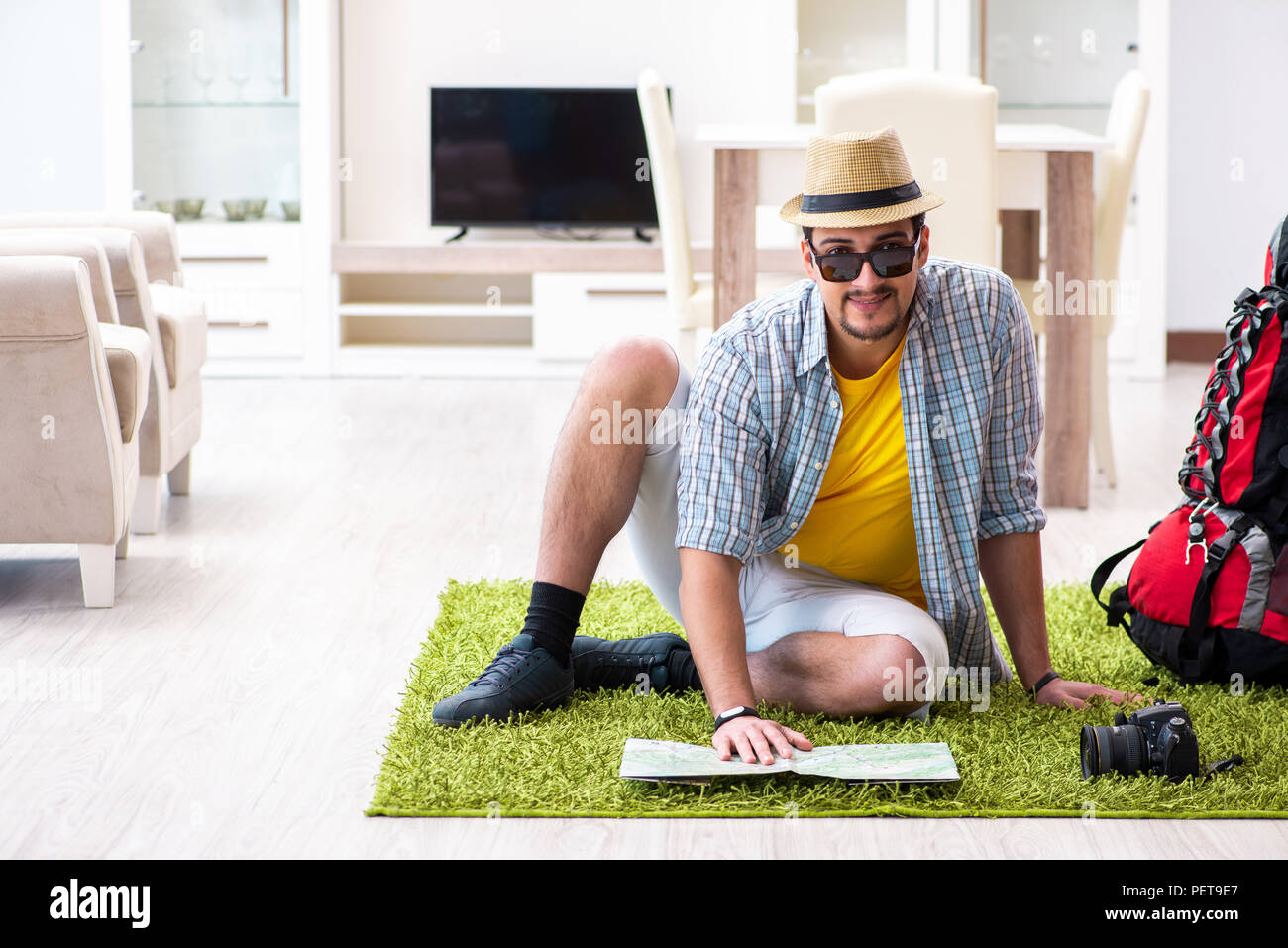 Man planning his travel with map Stock Photo - Alamy