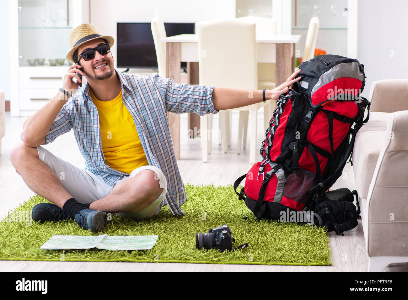Man planning his travel with map Stock Photo - Alamy