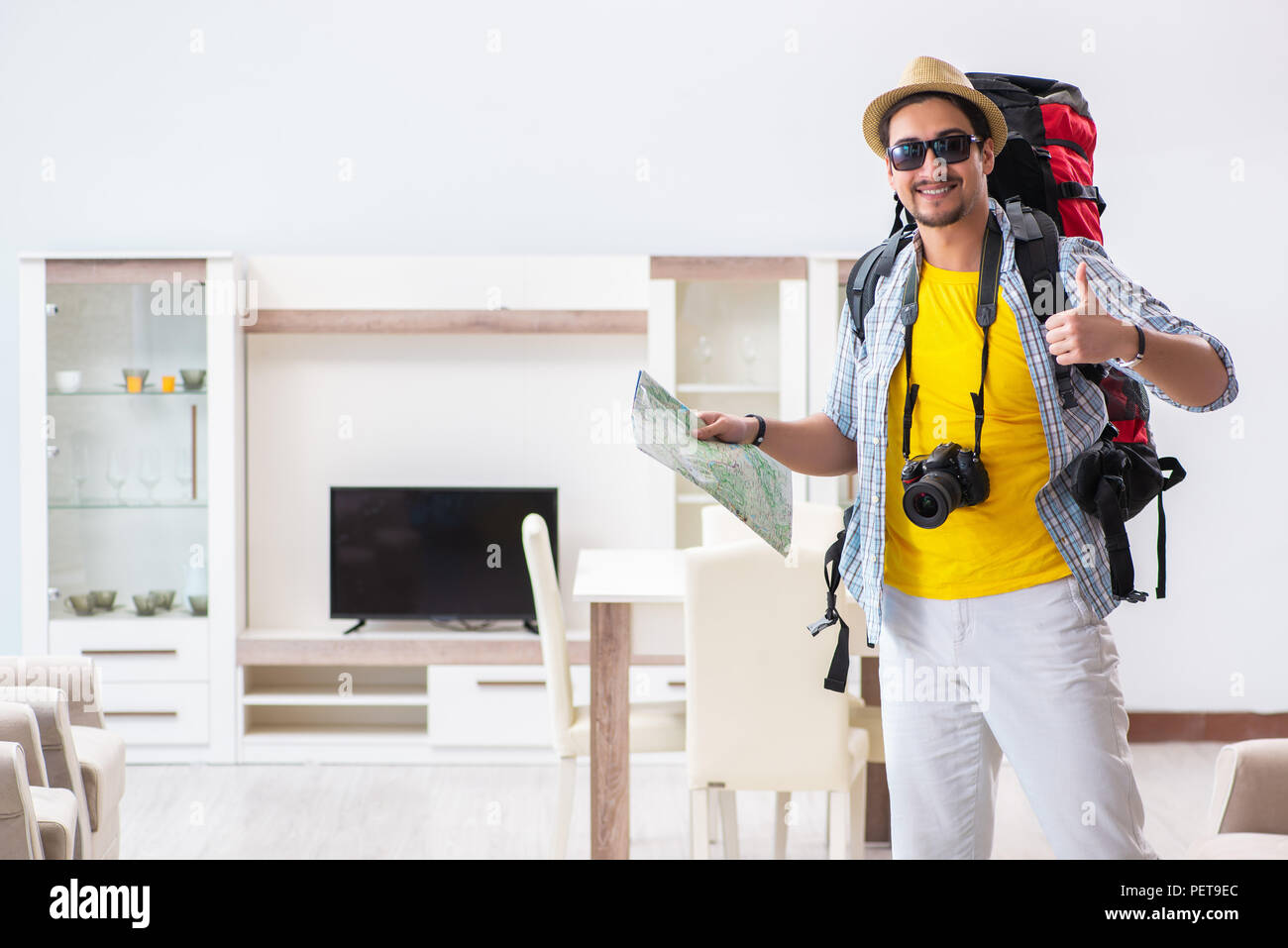 Man planning his travel with map Stock Photo - Alamy