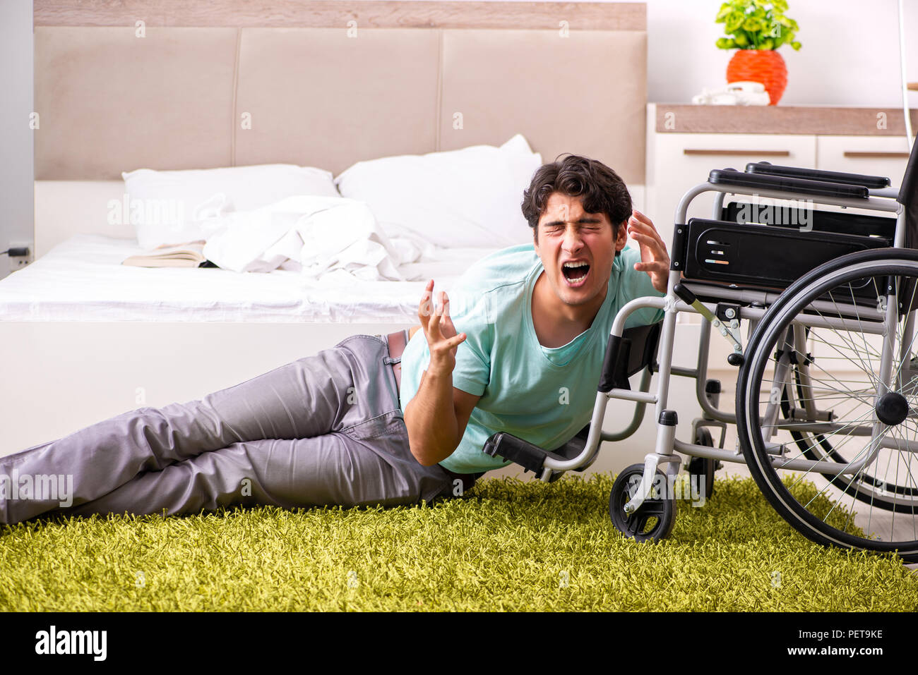 Young handsome disabled man recovering at home Stock Photo - Alamy