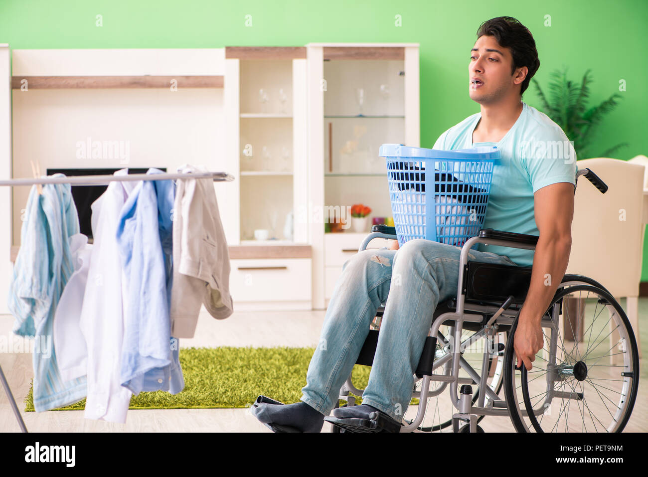 Laundry basket on chair hi-res stock photography and images - Alamy
