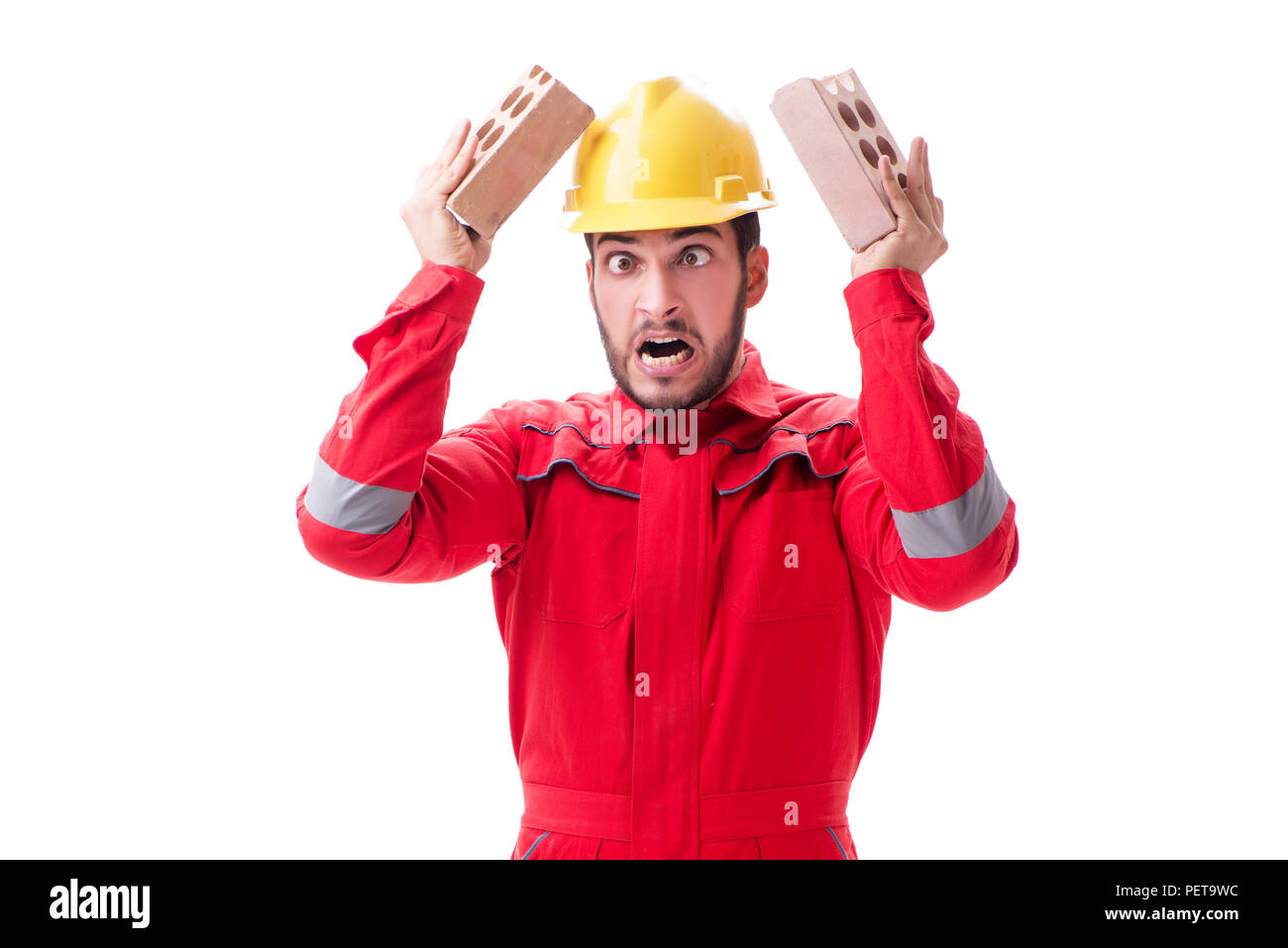 Angry builder breaking bricks isolated on white Stock Photo - Alamy