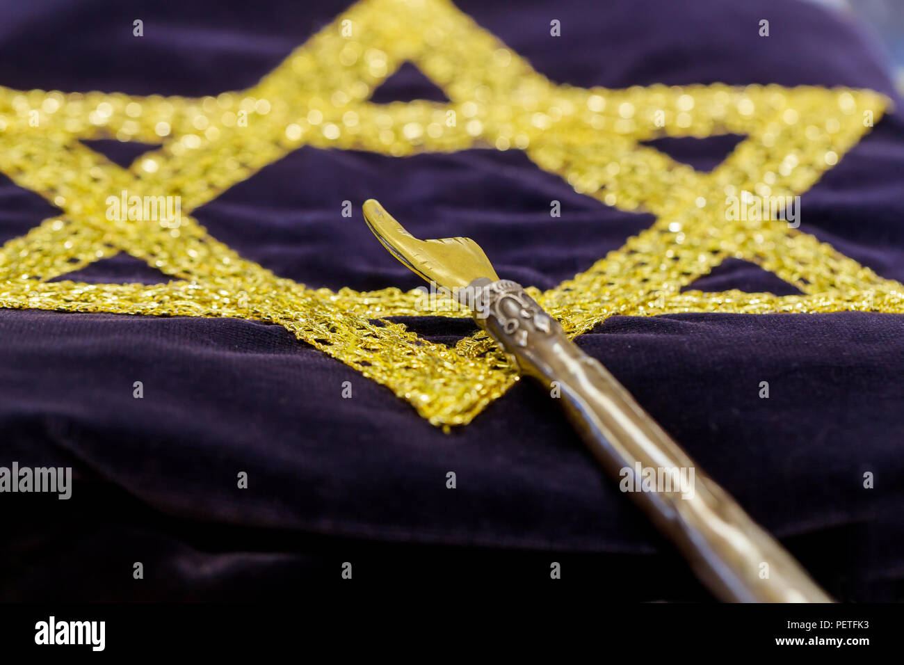 Stylish Yad carved pointer for reading the Torah Stock Photo - Alamy