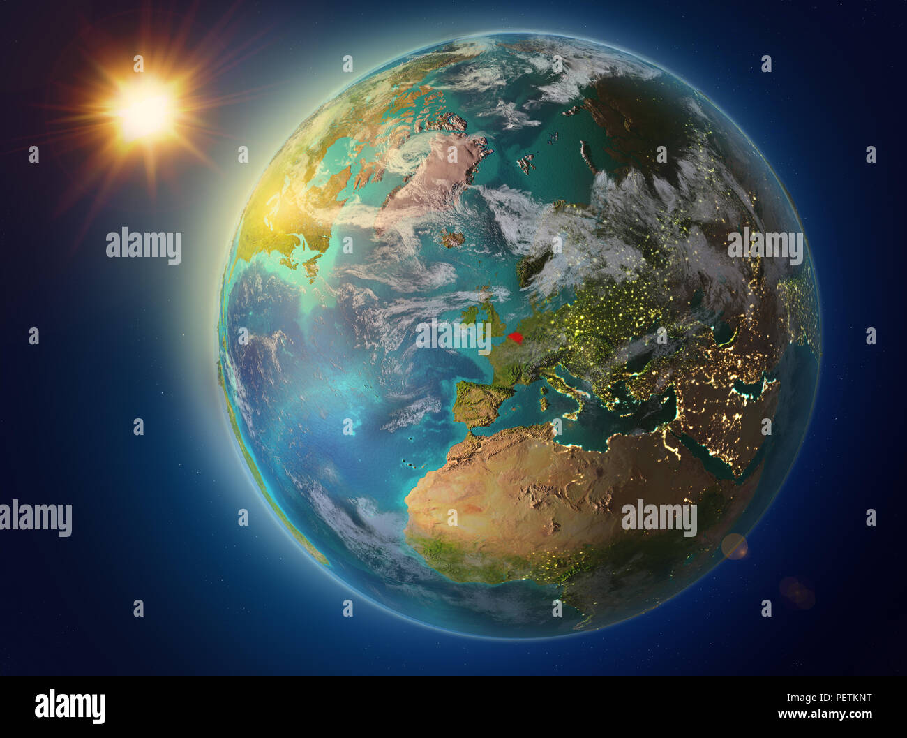 Sunset above Belgium highlighted in red on planet Earth with atmosphere and clouds. 3D ...