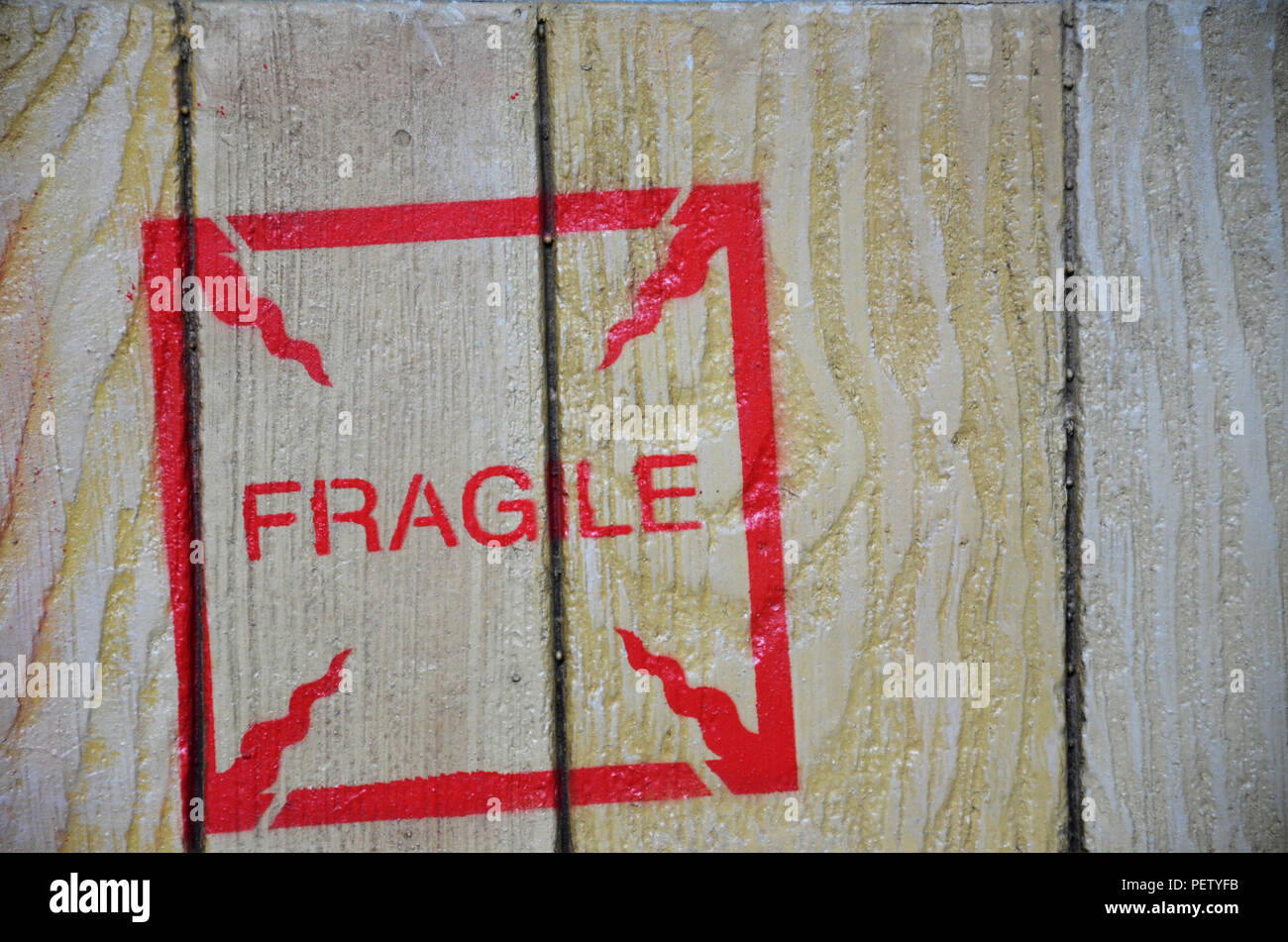 Red fragile stenciled on shipping packing crate Stock Photo - Alamy