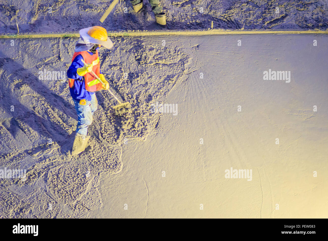 Mason worker leveling concrete with trowels, mason hands spreading ...