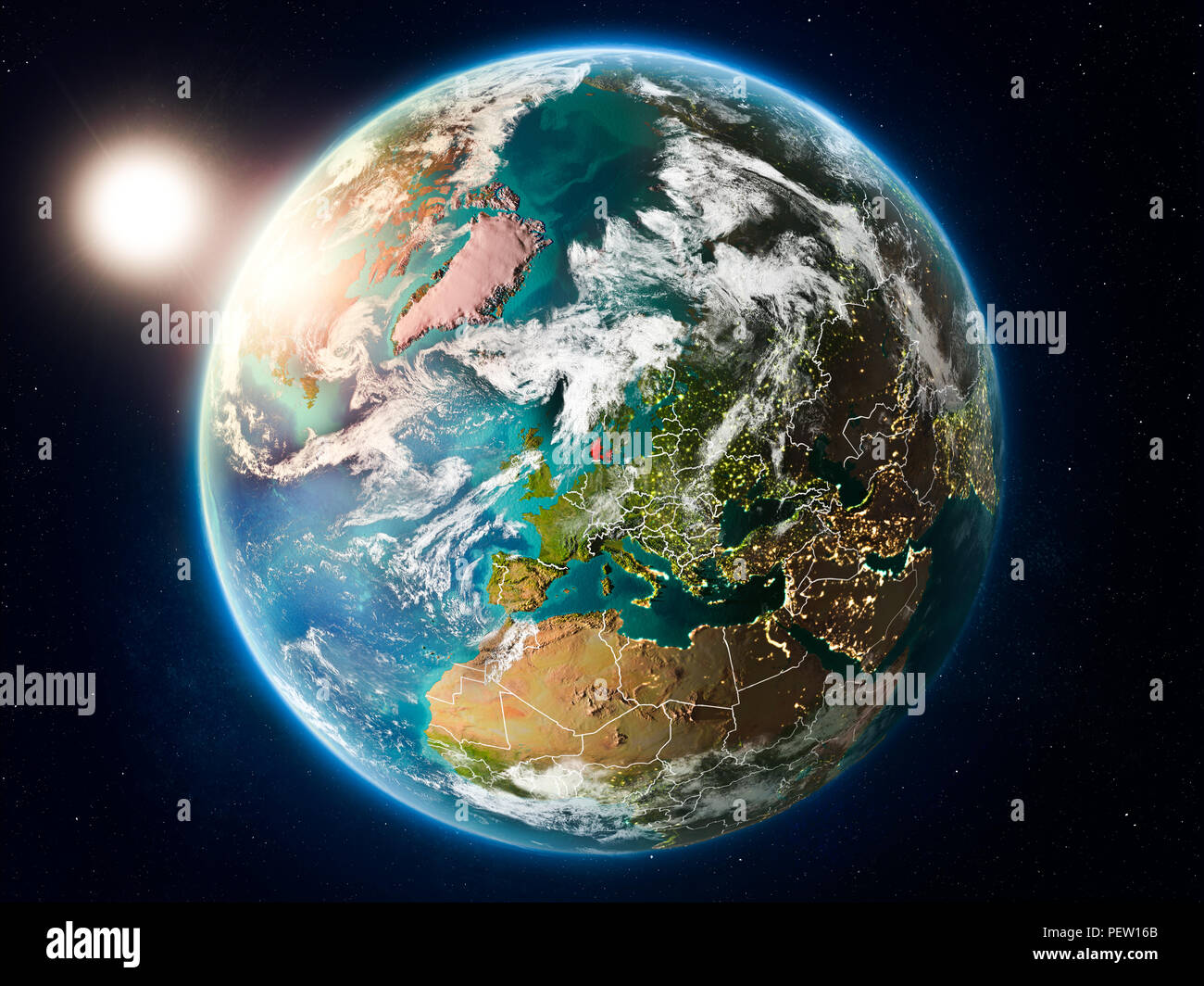 Sunset above Denmark highlighted in red on planet Earth with clouds and visible country borders ...