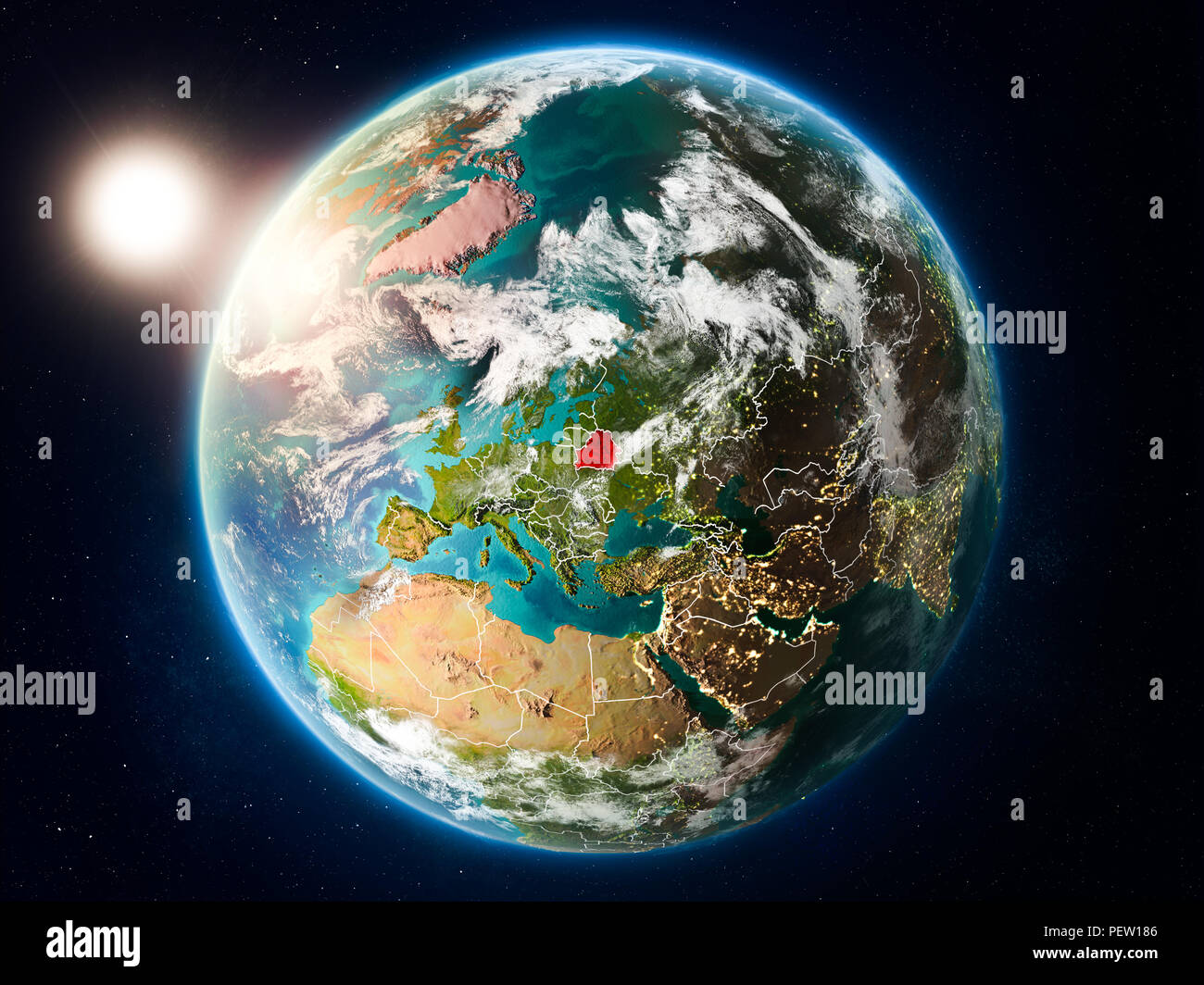 Sunset above Belarus highlighted in red on planet Earth with clouds and visible country borders ...