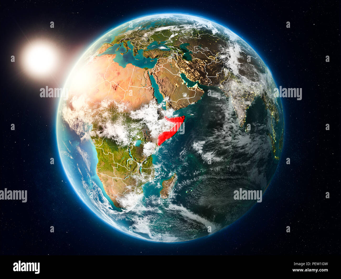 Sunset above Somalia highlighted in red on planet Earth with clouds and ...