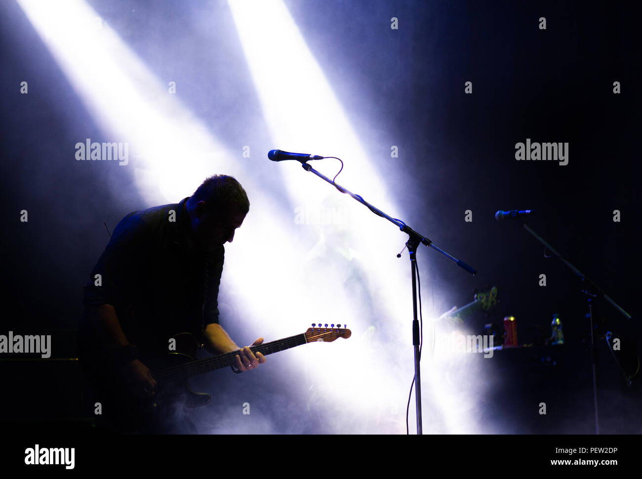 Rock singer on a stage singing rock song Stock Photo - Alamy