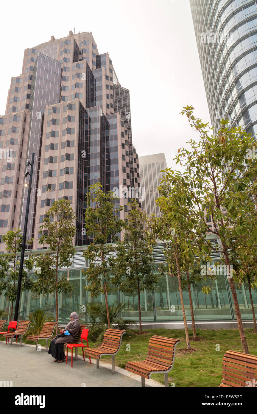 Woman sit on the bench in the rooftop park at Transbay Transit Center ...
