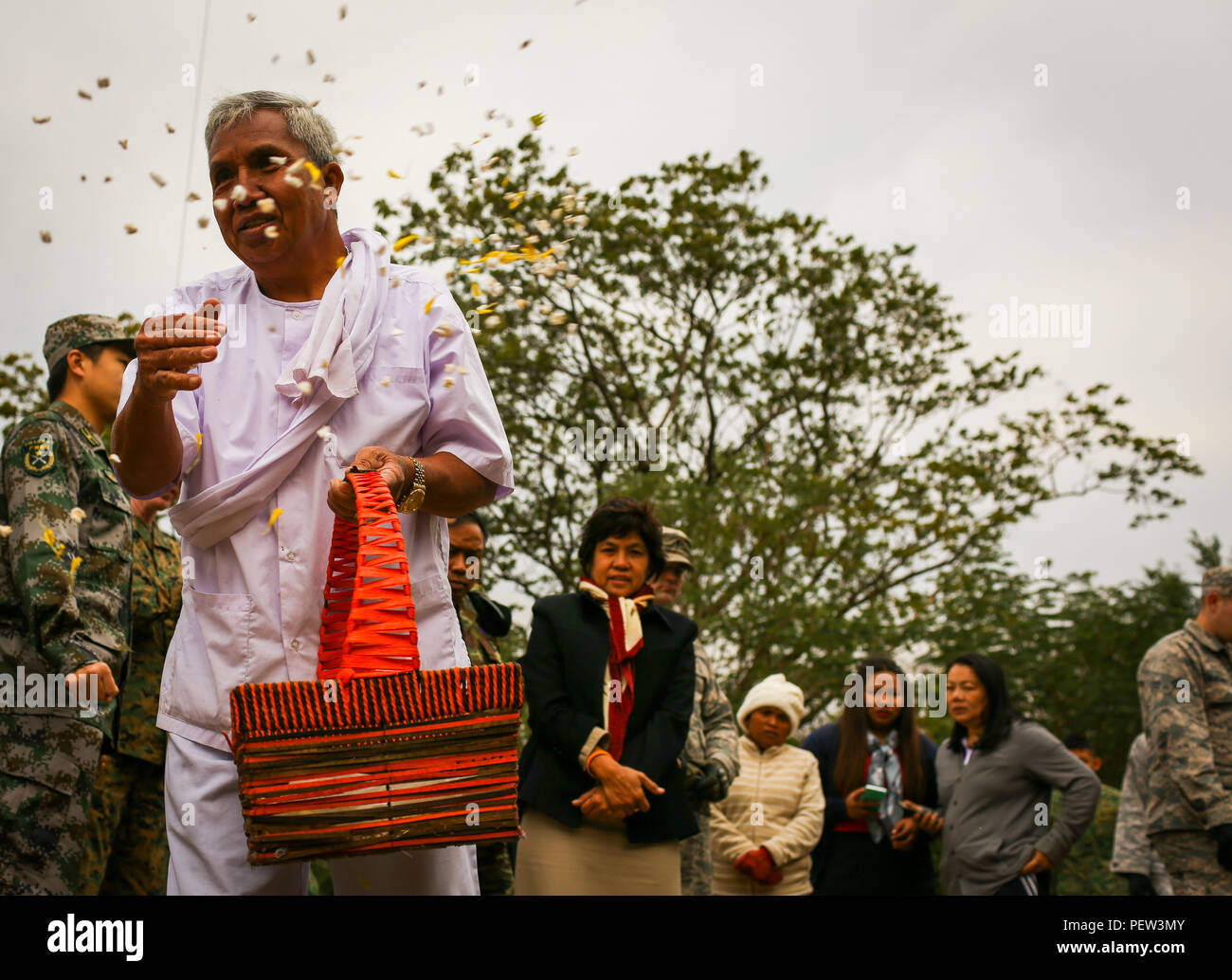 Samai Tanapai Bul tosses flowers during a blessing given at the Wuat ...