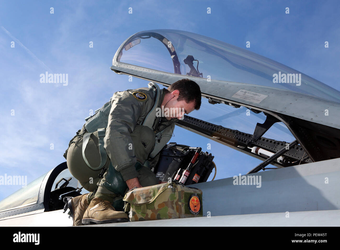 A Royal Australian Air Force pilot conducts preflight checks on the ...