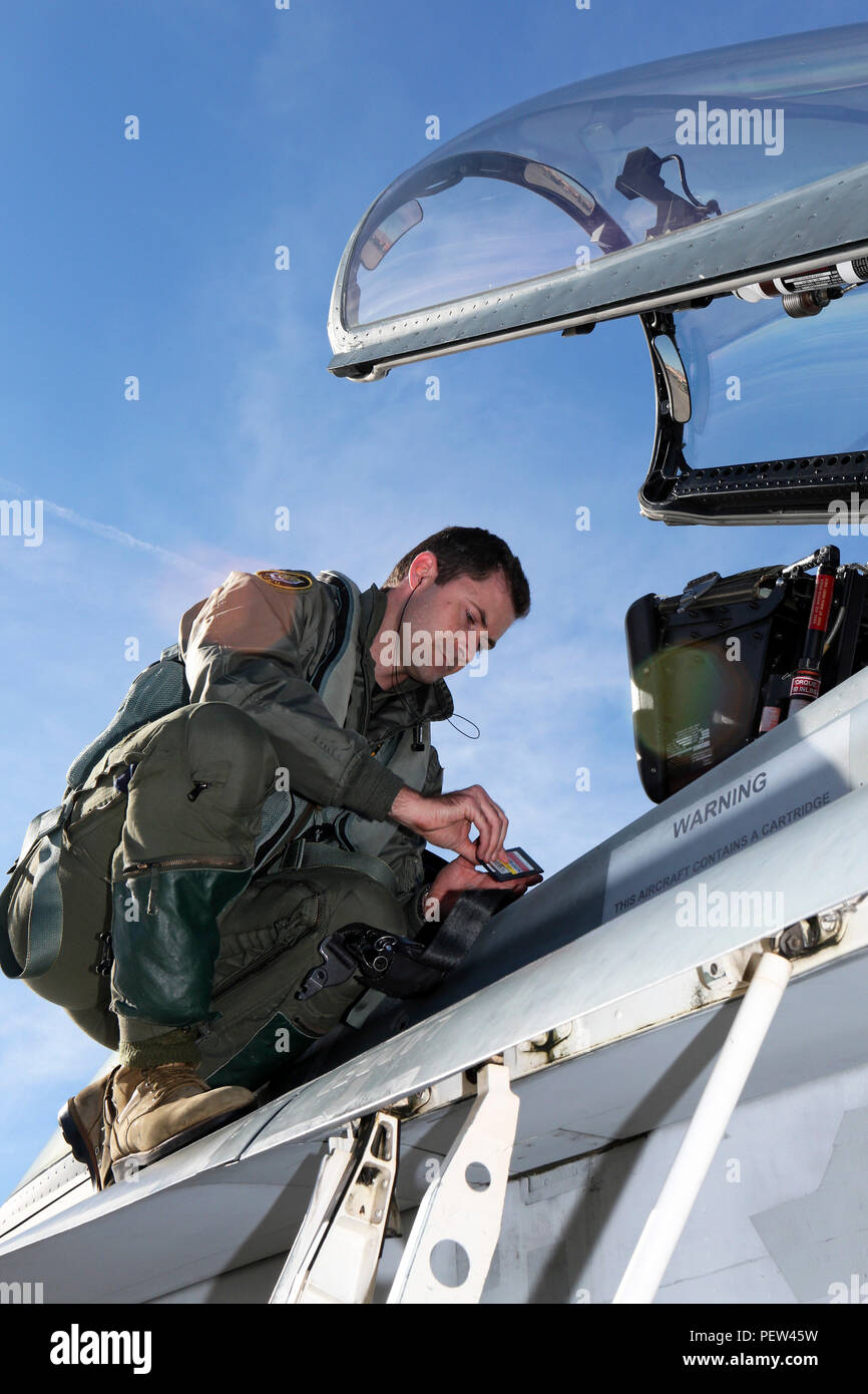 A Royal Australian Air Force pilot conducts preflight checks on the ...