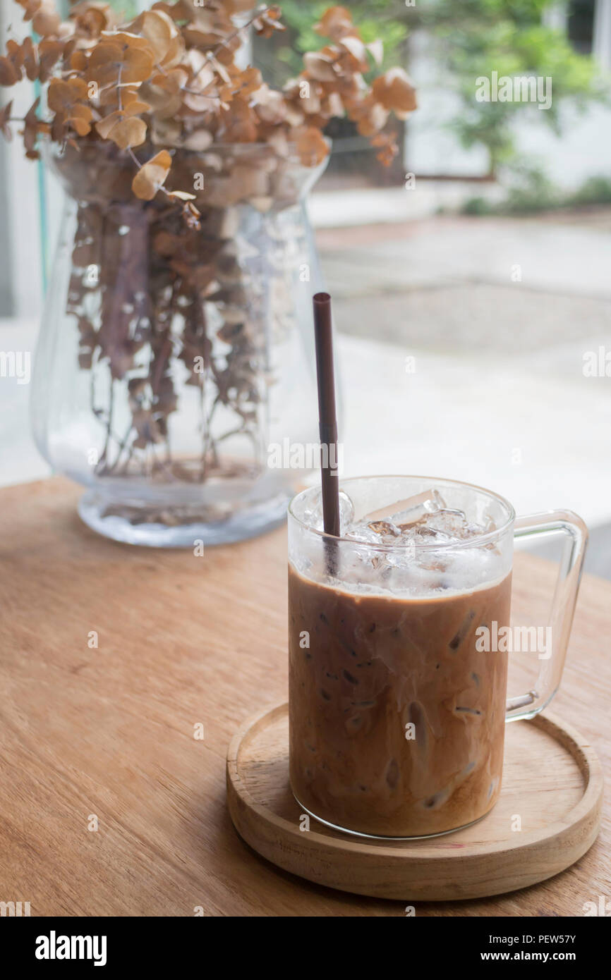 Iced milk mocha on wooden table, stock photo Stock Photo - Alamy