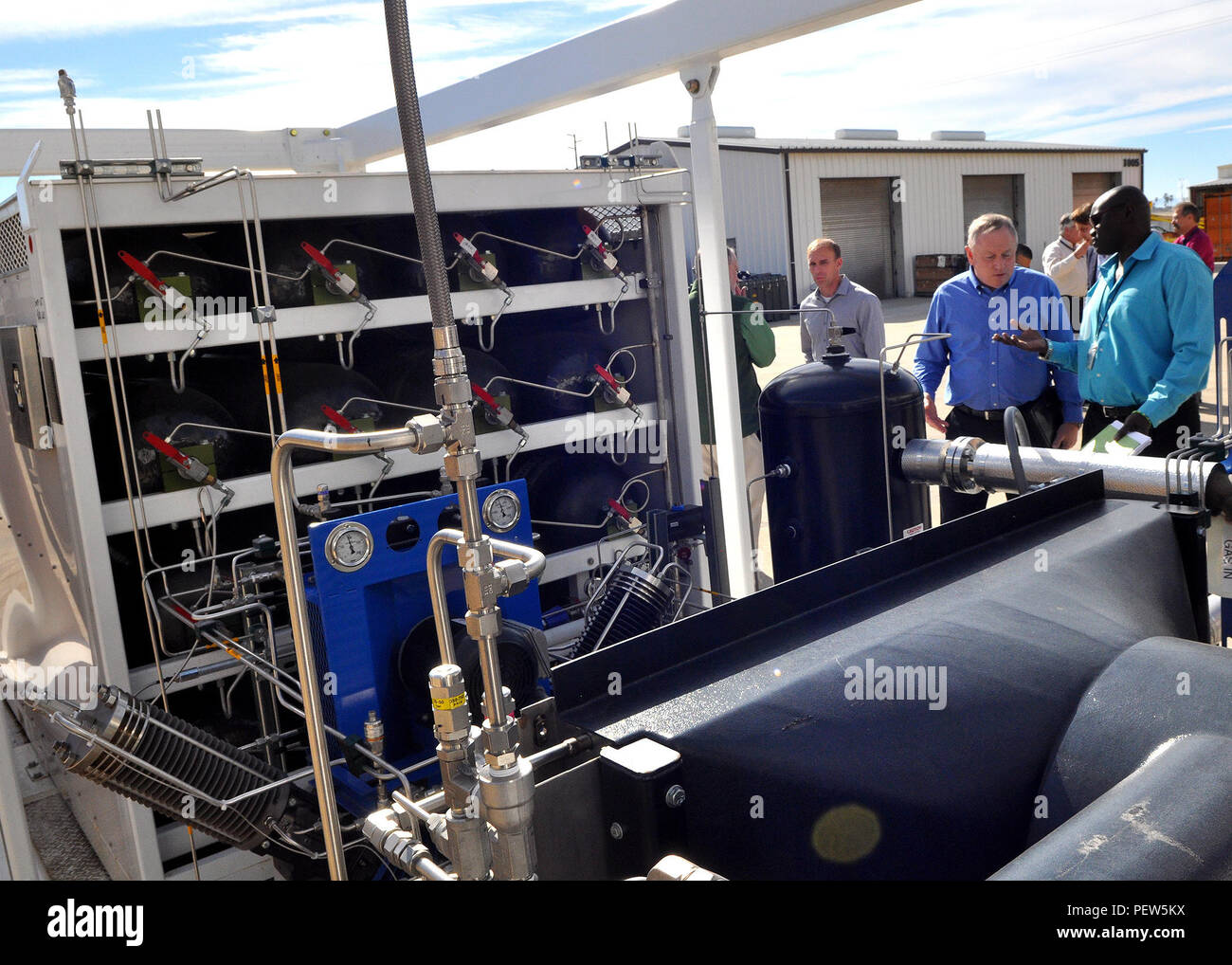 PORT HUENEME, Calif. – Robert Okwera, electrical engineer, MSEE, (right ...