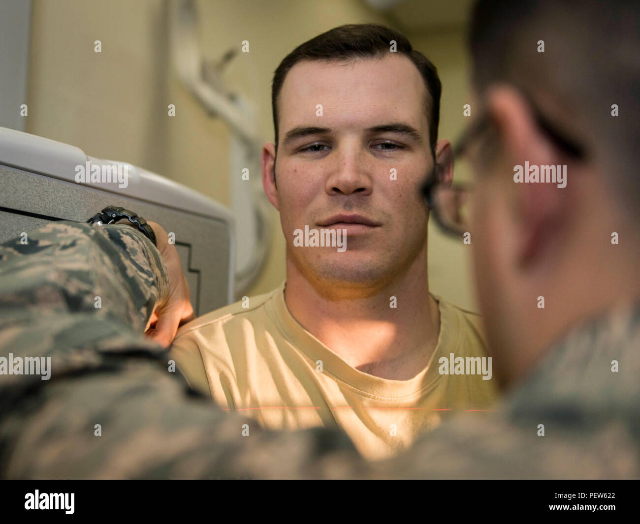 U.S. Air Force Airman 1st Class Jason Grosso positions Staff Sgt. Mike ...