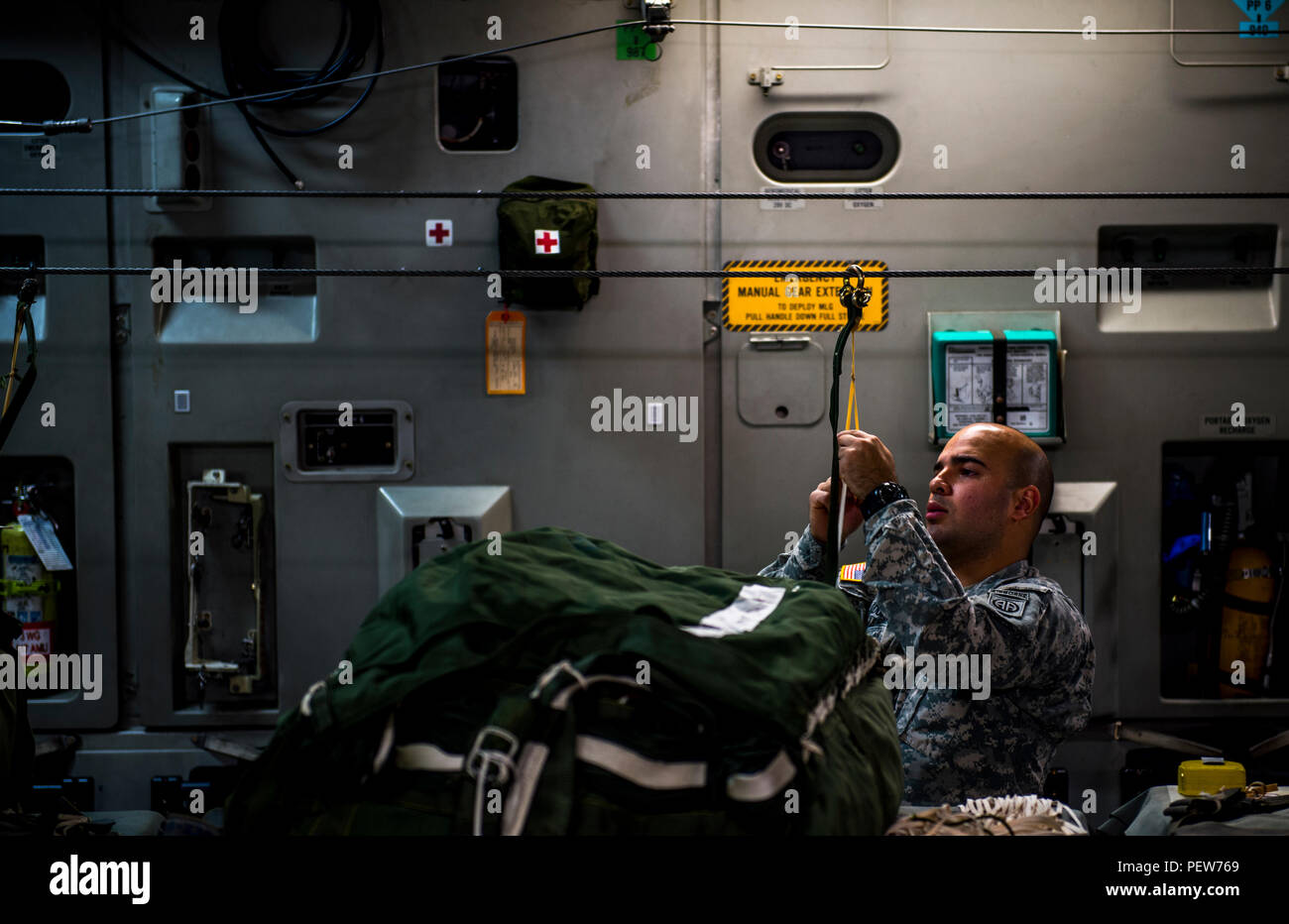 U.S. Army Spc. Arquimedes Duran, a parachute rigger with the 11th ...