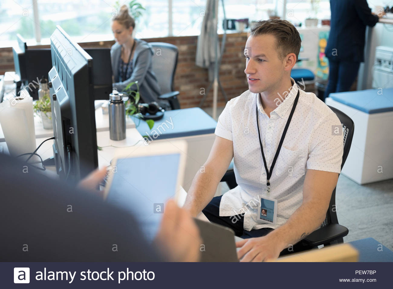 Watching over shoulder working hi-res stock photography and images - Alamy