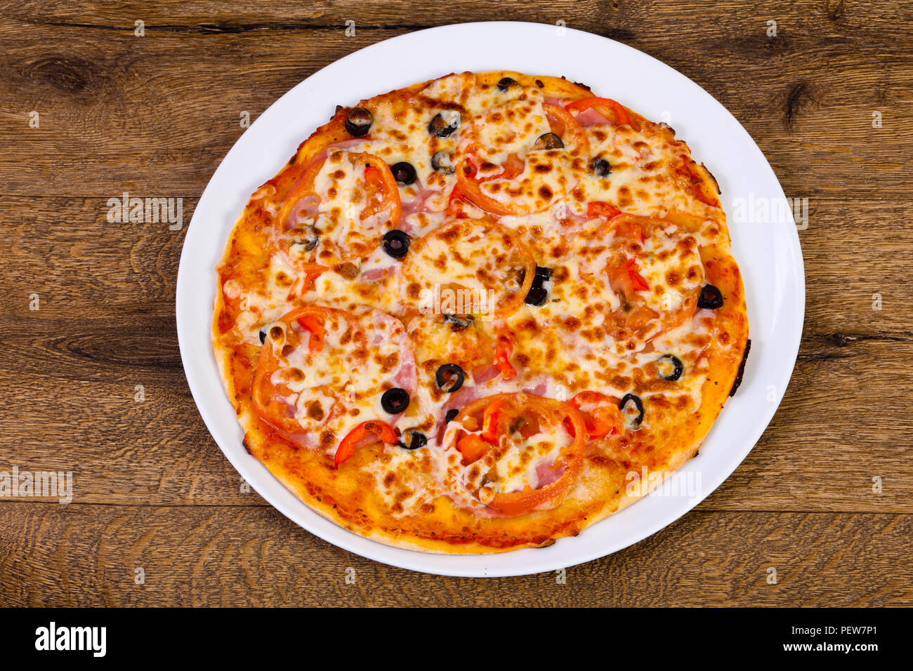 Pizza with ham and cheese Stock Photo - Alamy
