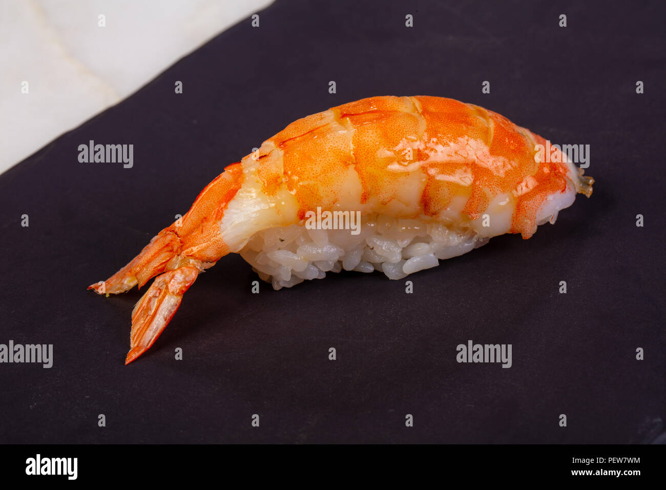 Shrimp nigiri sushi over stone background Stock Photo - Alamy