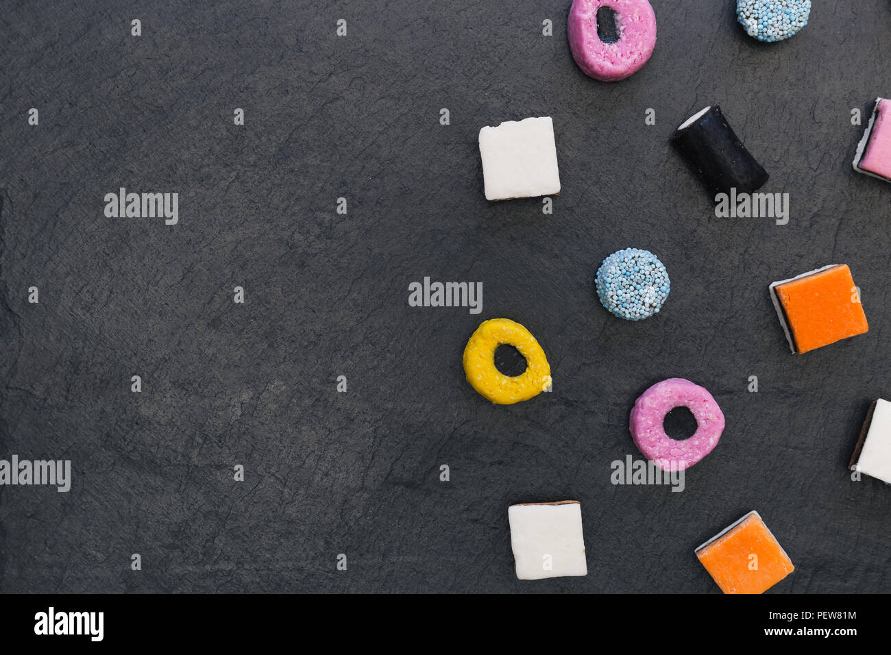 Liquorice allsorts candy sweets on dark background Stock Photo - Alamy