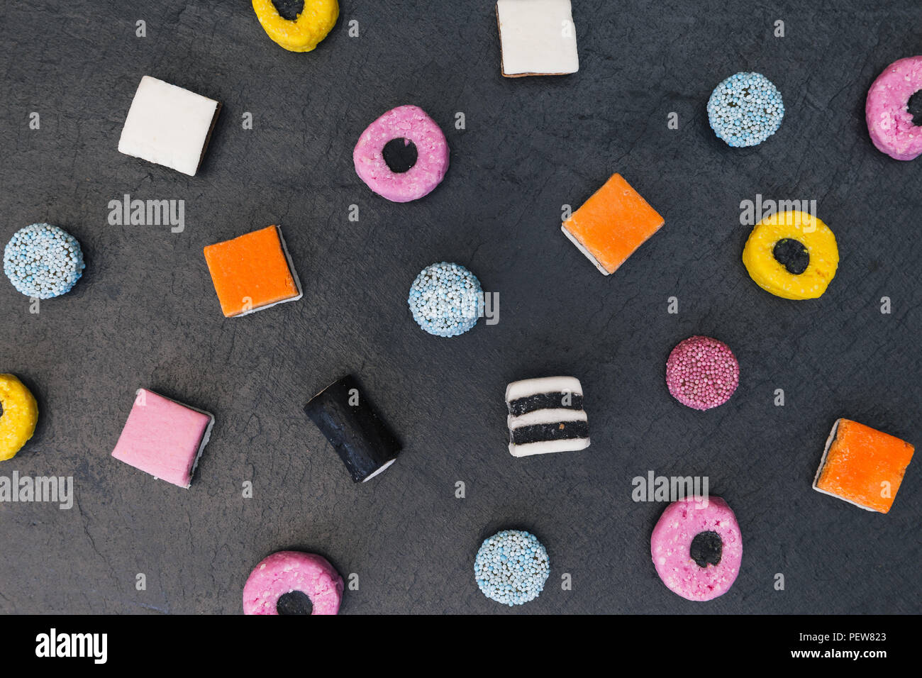 Liquorice allsorts candy sweets on dark background Stock Photo - Alamy